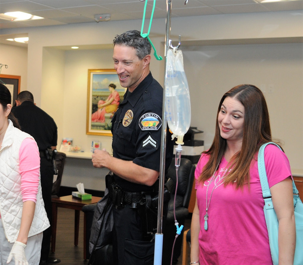 Police officers provide comfort to cancer patients in the most personal ...