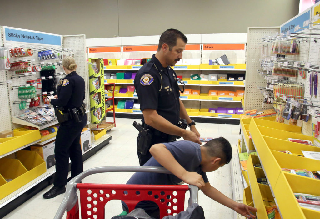 Pasadena police officers take kids on a shopping spree for school ...
