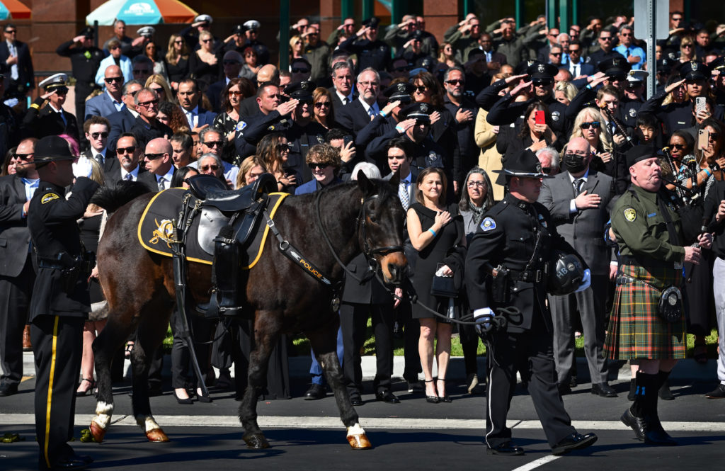 Thousands gather at Honda Center to remember Huntington Beach Officer ...